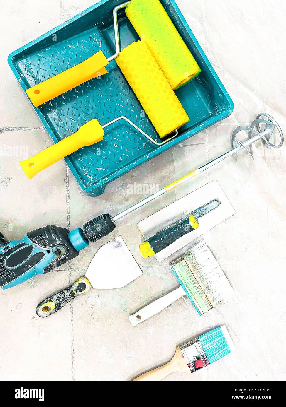 Set of tools for decorator work on a tile background Stock Photo - Alamy