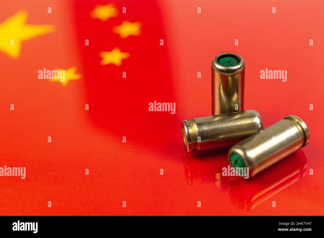 Gun bullets over the China flag. Criminal and corruption concept ...