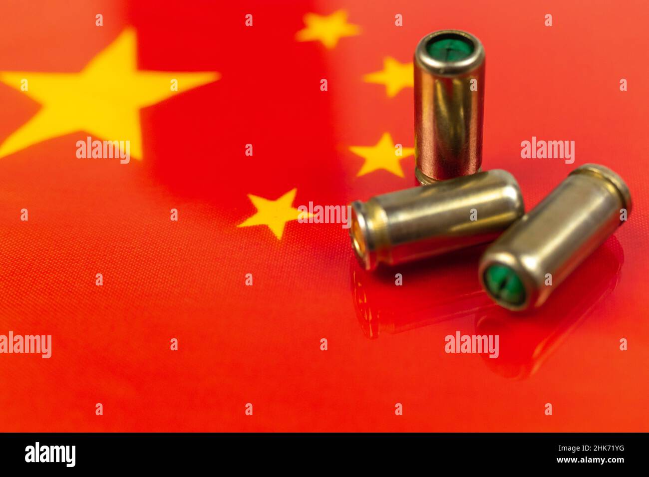 Gun bullets over the China flag. Criminal and corruption concept ...