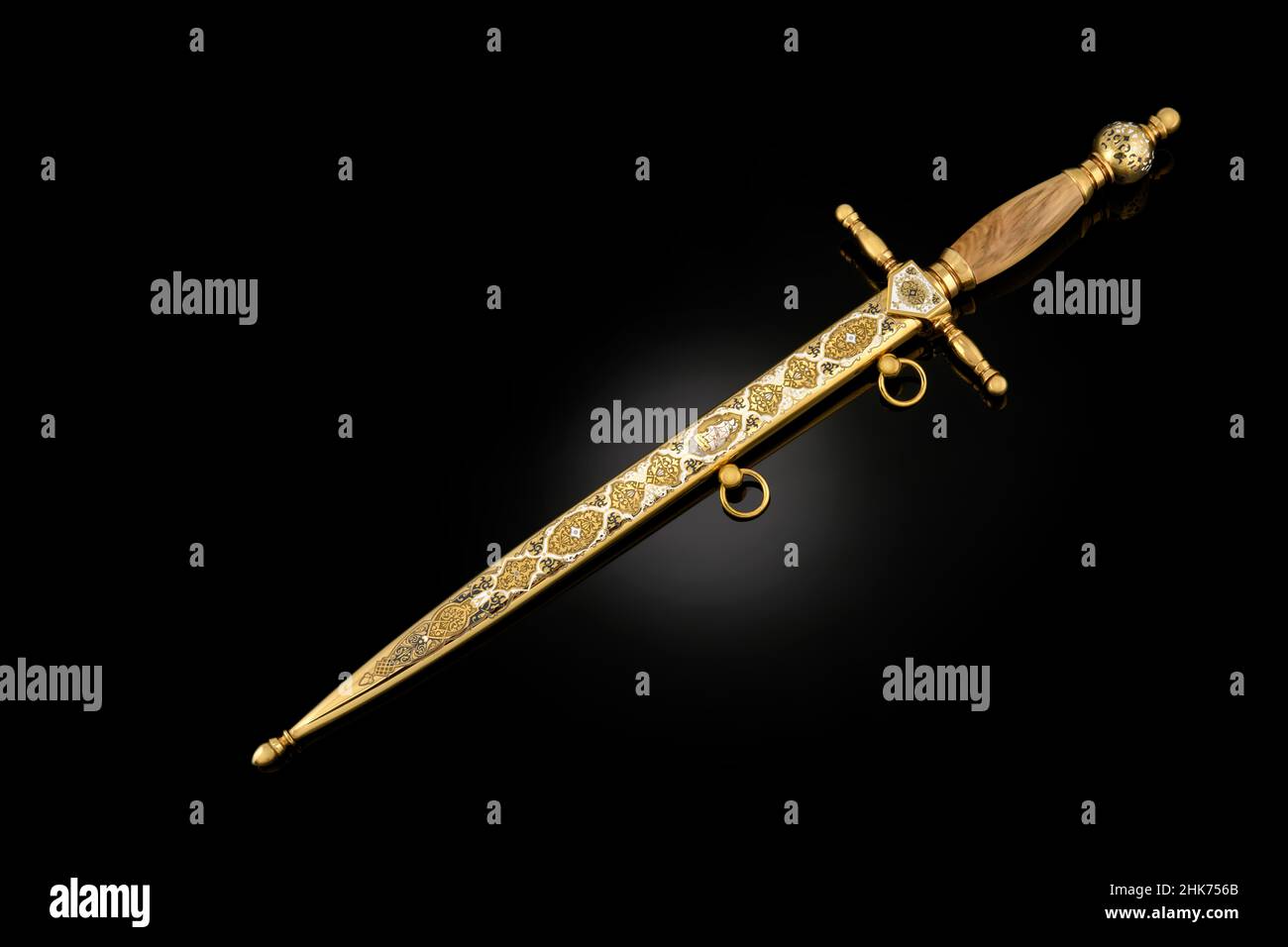 souvenir collectible silver gold dagger with scabbard on black. Luxury ...