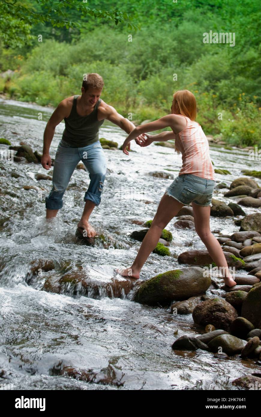Beautiful young couple helping other hi-res stock photography and ...