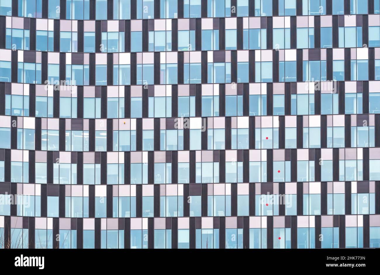 Detail of a modern office building. Glass building office in the center ...