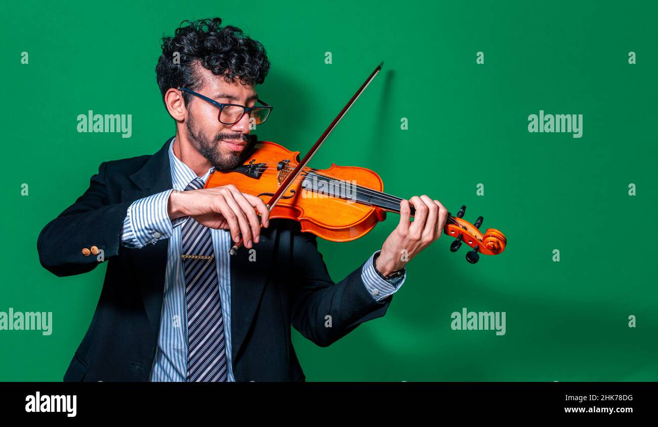 Attractive young man playing violin, guy playing violin isolated ...