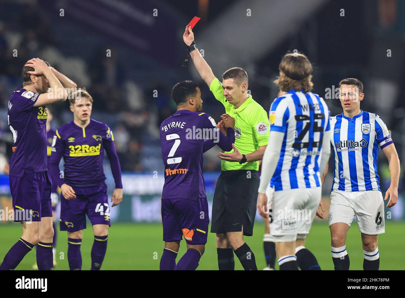 Referee Matthew Donohue gives a red card to Richard Stearman #16 of ...