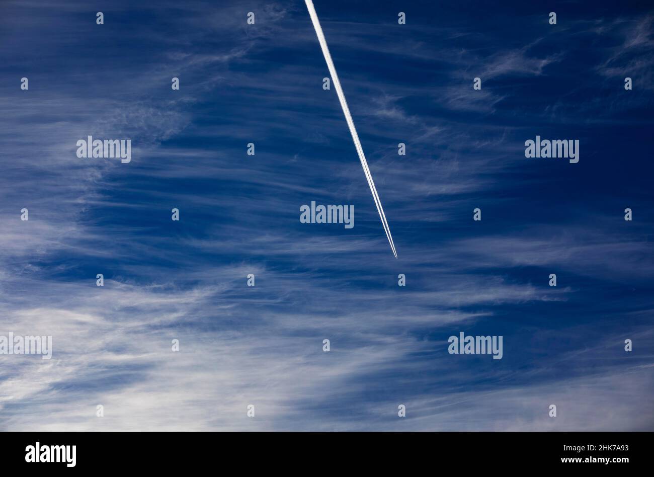 Cloudy sky with contrails, cirrus clouds or feather clouds, Austria ...