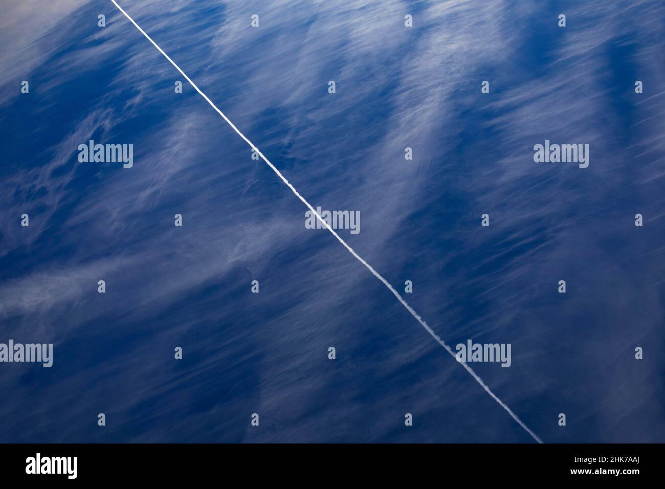 Cloudy sky with contrails, cirrus clouds or feather clouds, Austria ...