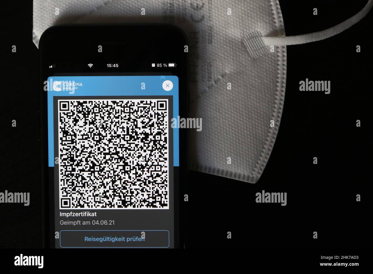 FFP2 mask and iPhone with Corona warning app with QR code for ...