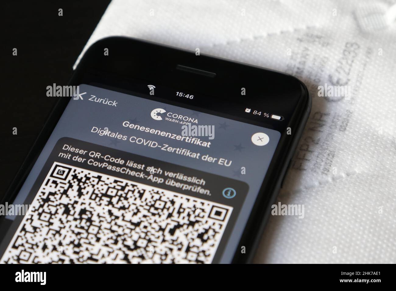 FFP2 mask and iPhone with Corona warning app with QR code for ...