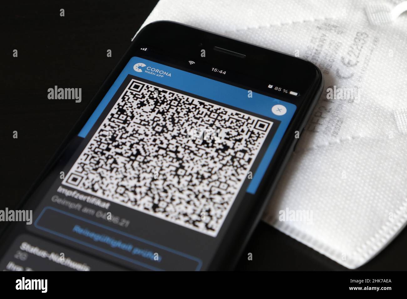 FFP2 mask and iPhone with Corona warning app with QR code for ...