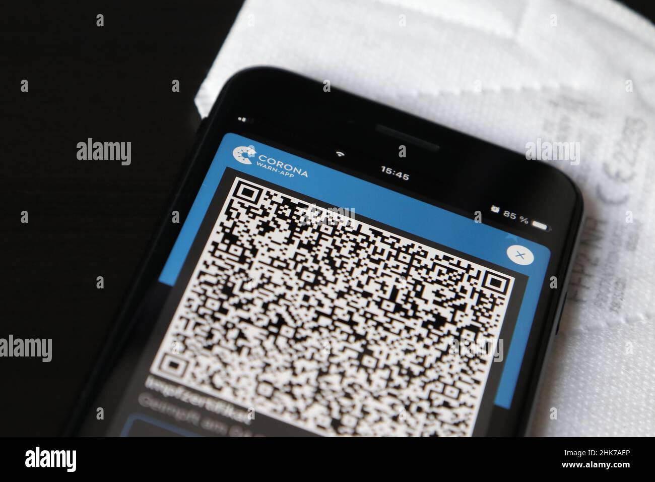 FFP2 mask and iPhone with Corona warning app with QR code for ...