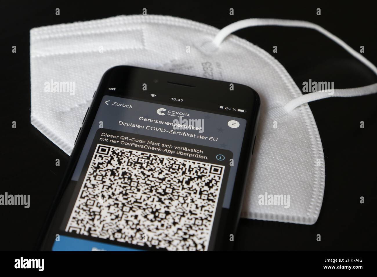 FFP2 mask and iPhone with Corona warning app with QR code for ...