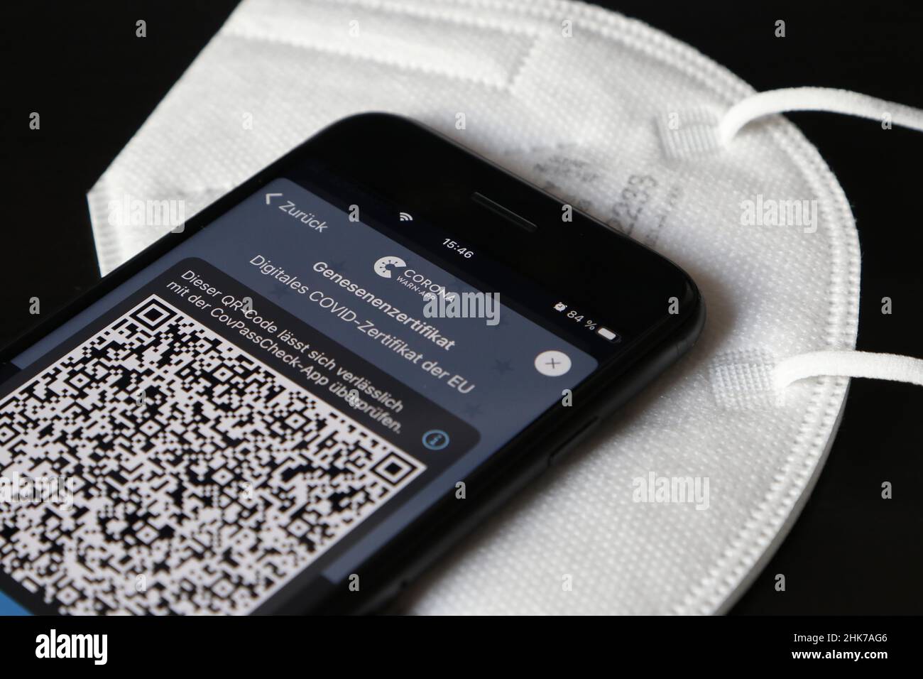 FFP2 mask and iPhone with Corona warning app with QR code for ...