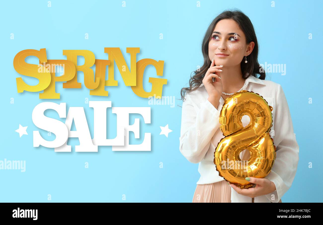 Young woman with balloon in shape of figure 8 on color background ...