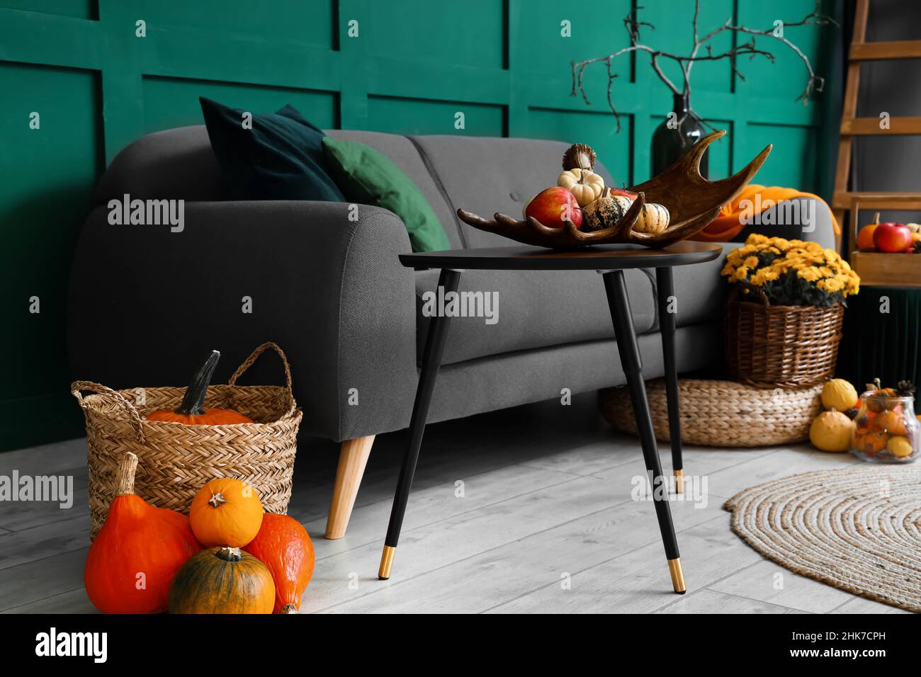 Interior of beautiful living room with autumn decor Stock Photo - Alamy