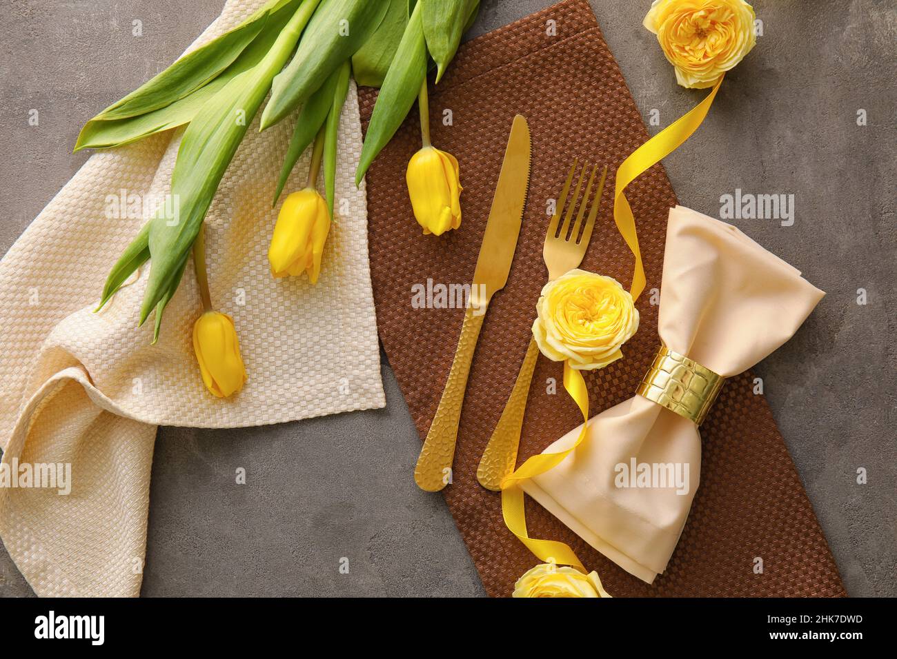 Stylish cutlery with beautiful flowers on grey background Stock Photo ...