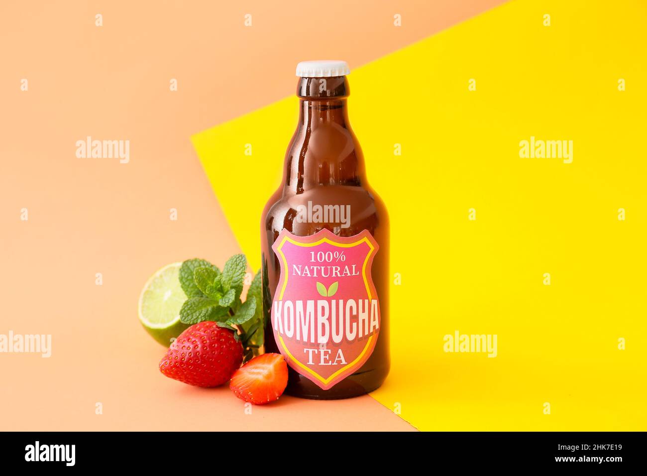 Bottle of fresh strawberry kombucha on color background Stock Photo - Alamy