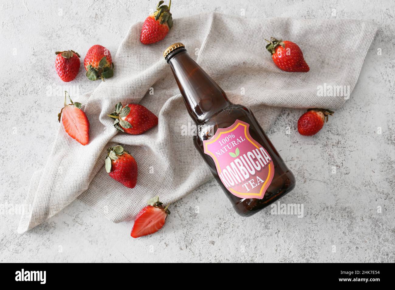 Bottle of fresh strawberry kombucha on light background Stock Photo - Alamy