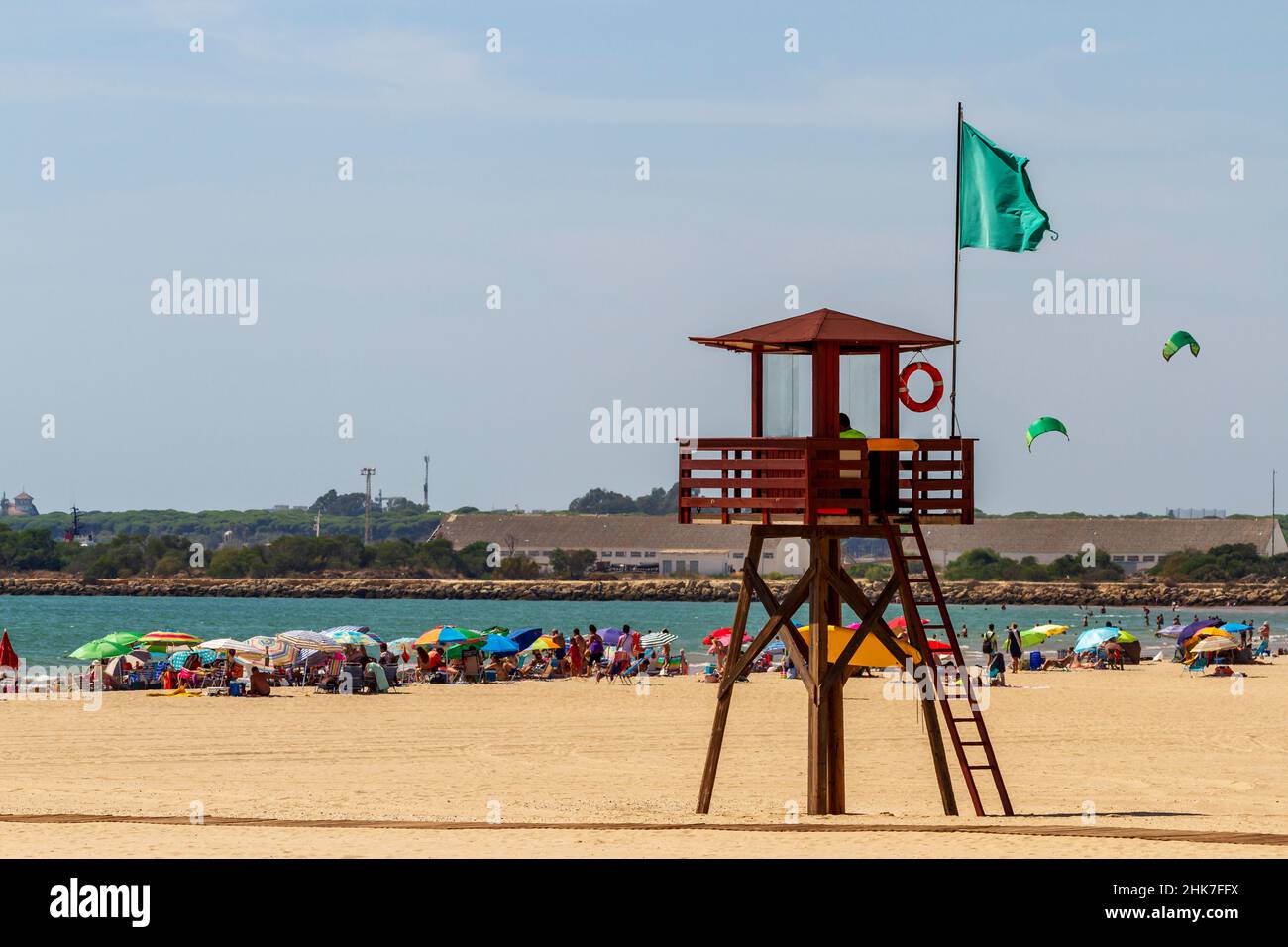 lifeguard keeping watch from the beach watchtower to protect bathers ...