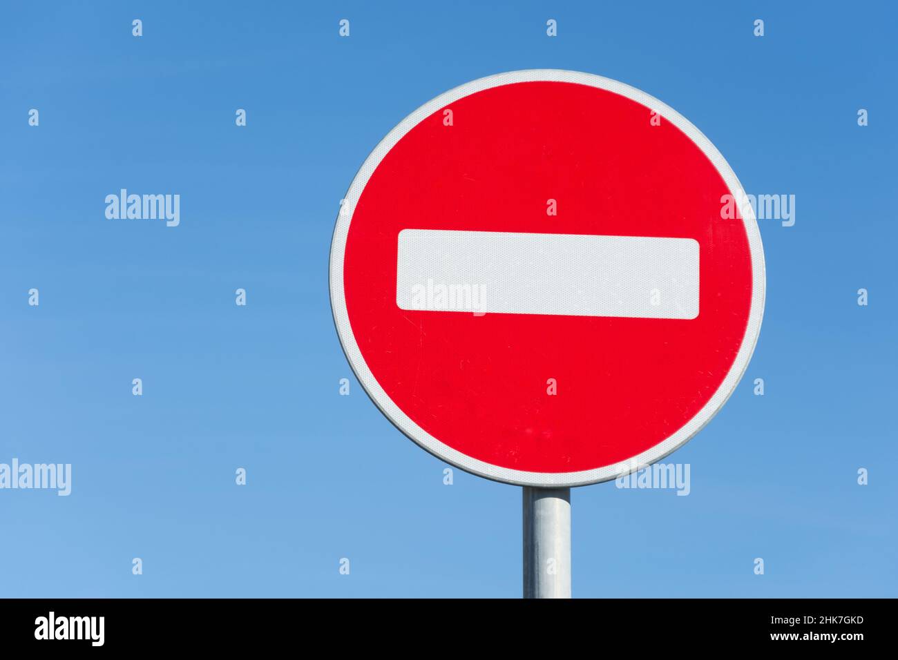 Round road stop sign, on a pole against the sky Stock Photo - Alamy