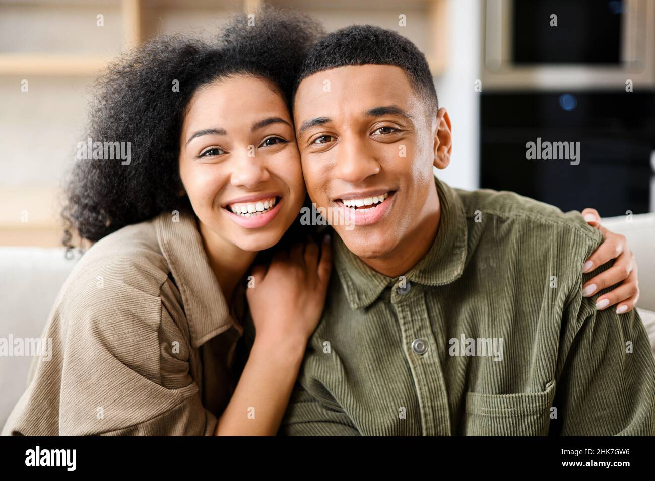 Happy together. Portrait of loving young husband and wife bonding to ...