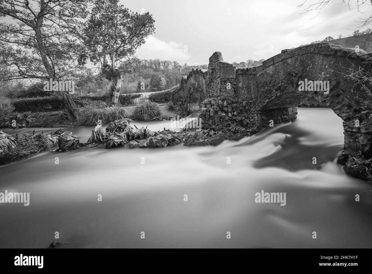 Long exposure of the river Avill flowing under Lovers bridge in the ...