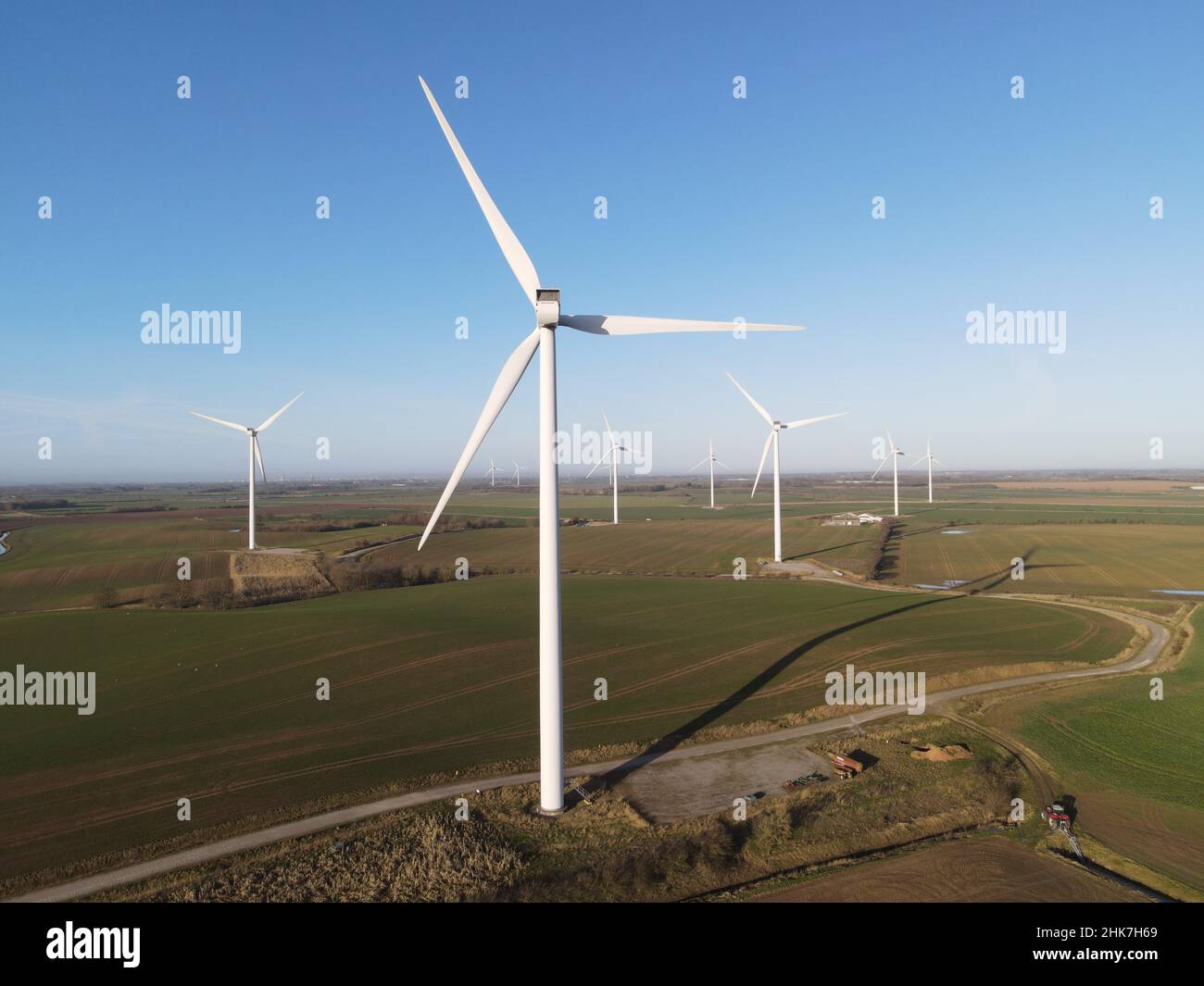 48Mpx Wind Turbines in sunny field Stock Photo - Alamy