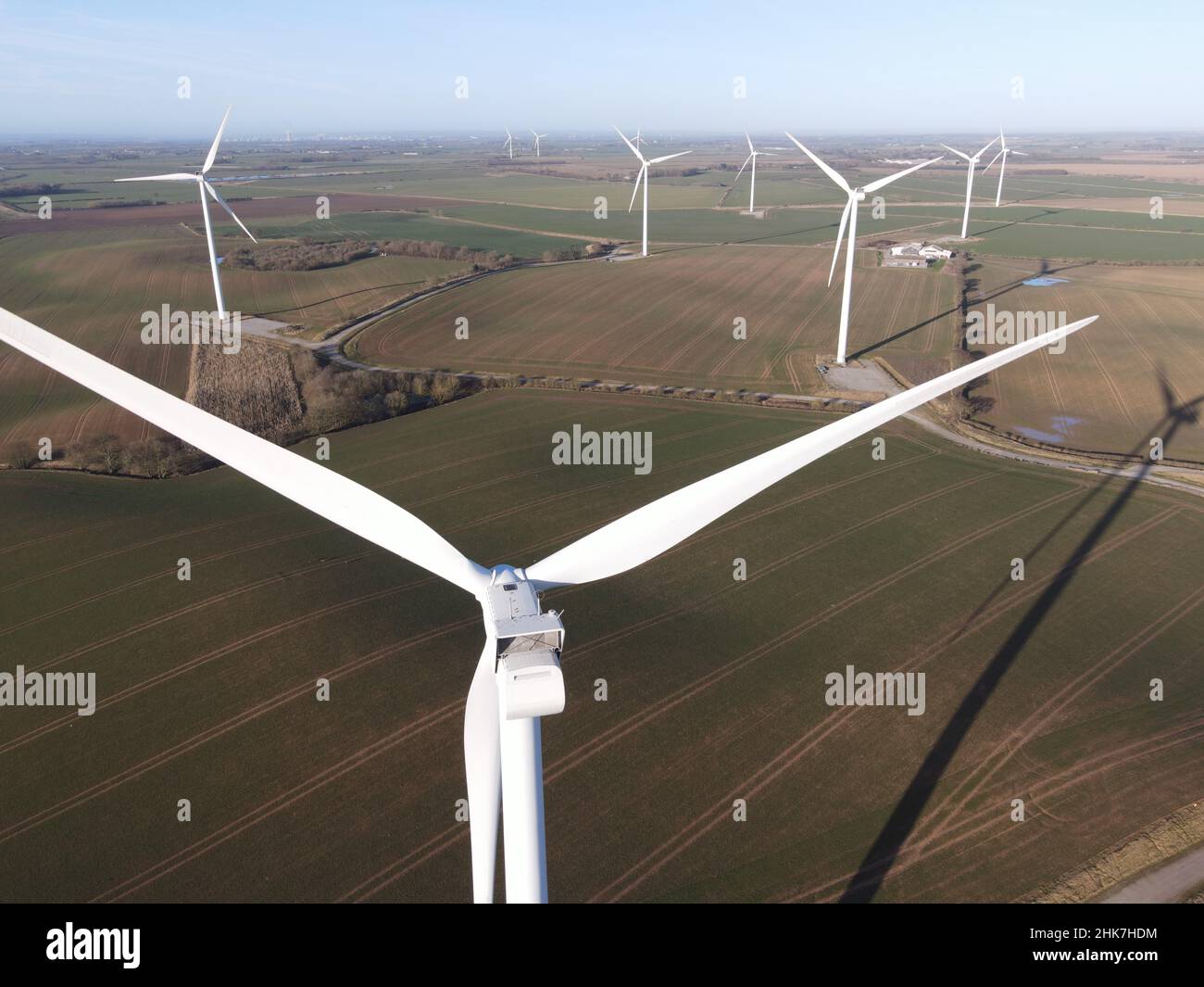 48Mpx Wind Turbines in sunny field Stock Photo - Alamy