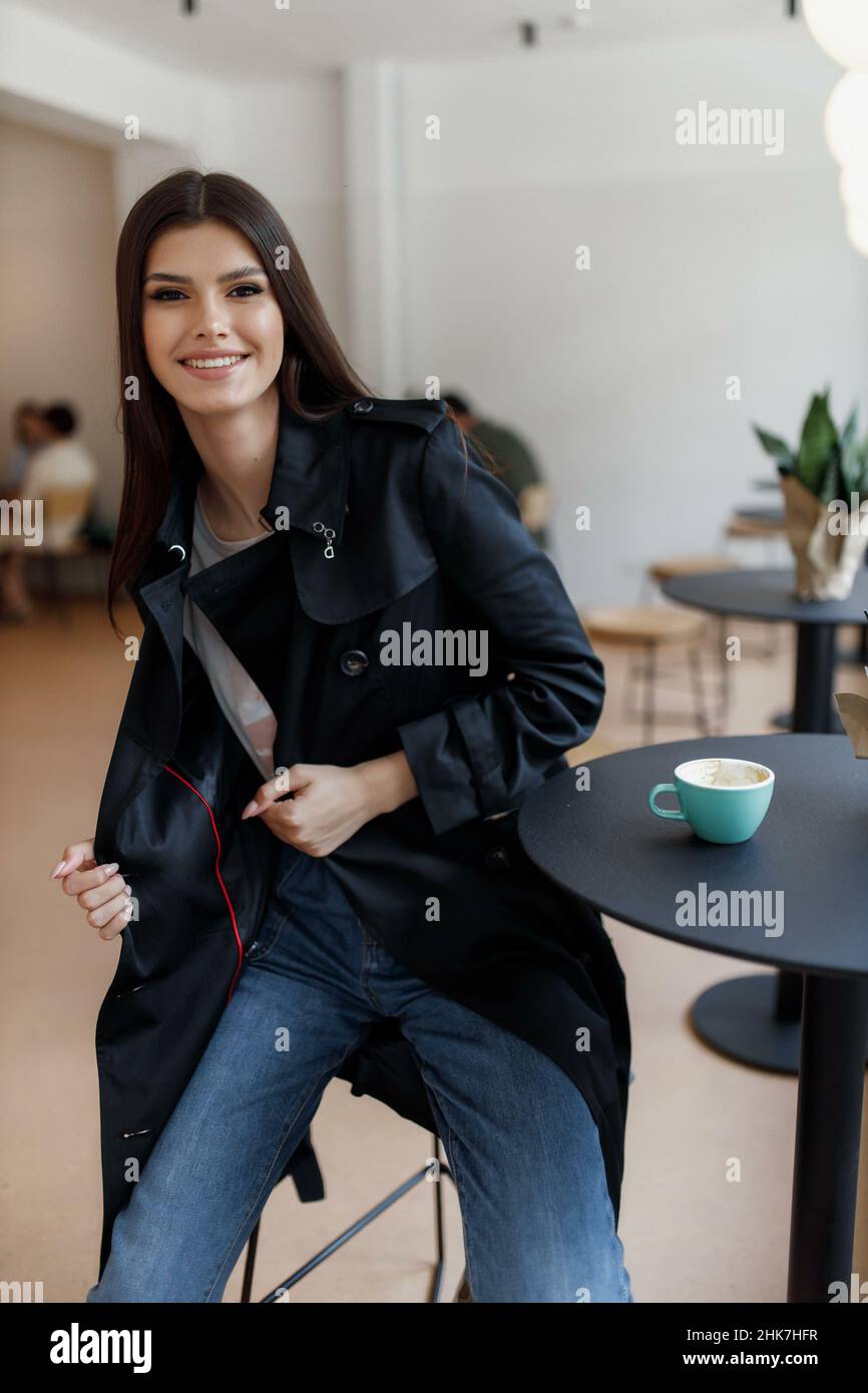 beautiful women in a coffee shop with a cup of coffee Stock Photo - Alamy