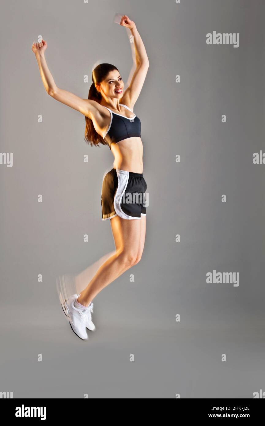 Side profile young woman jumping hi-res stock photography and images ...