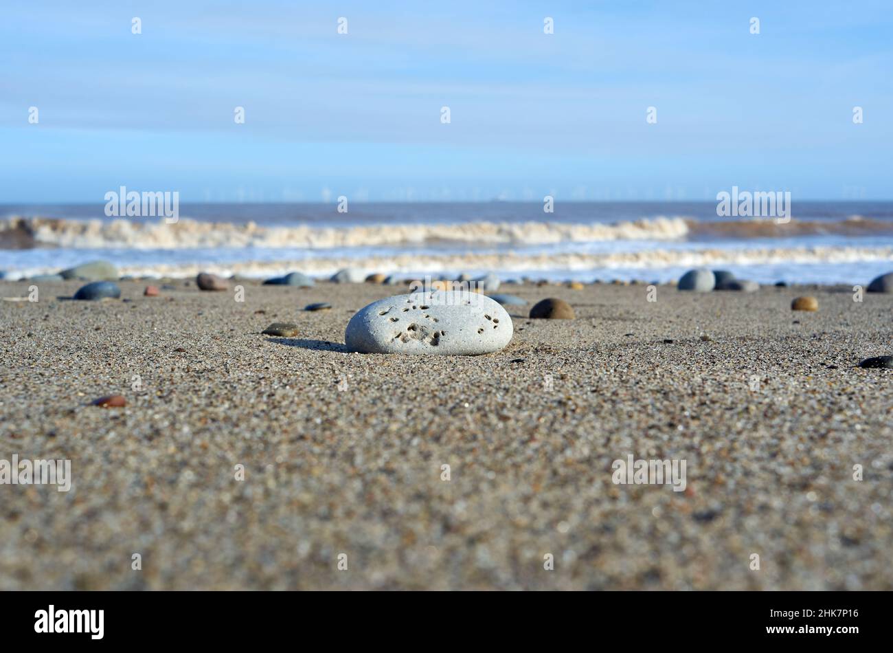 Smooth white stone washed up on a beach Stock Photo - Alamy