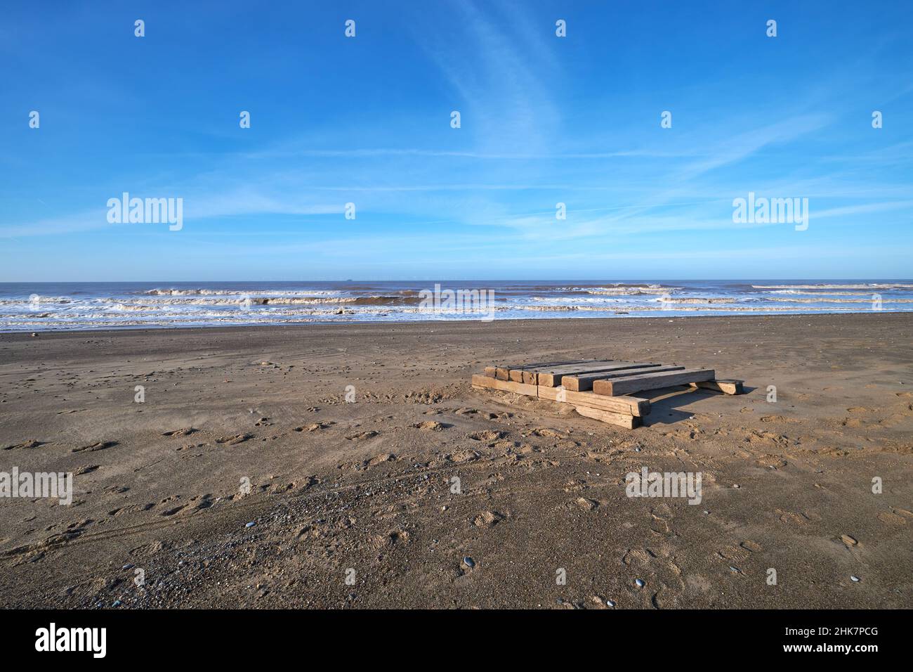 Heavy wooden raft washed up on a beach Stock Photo - Alamy