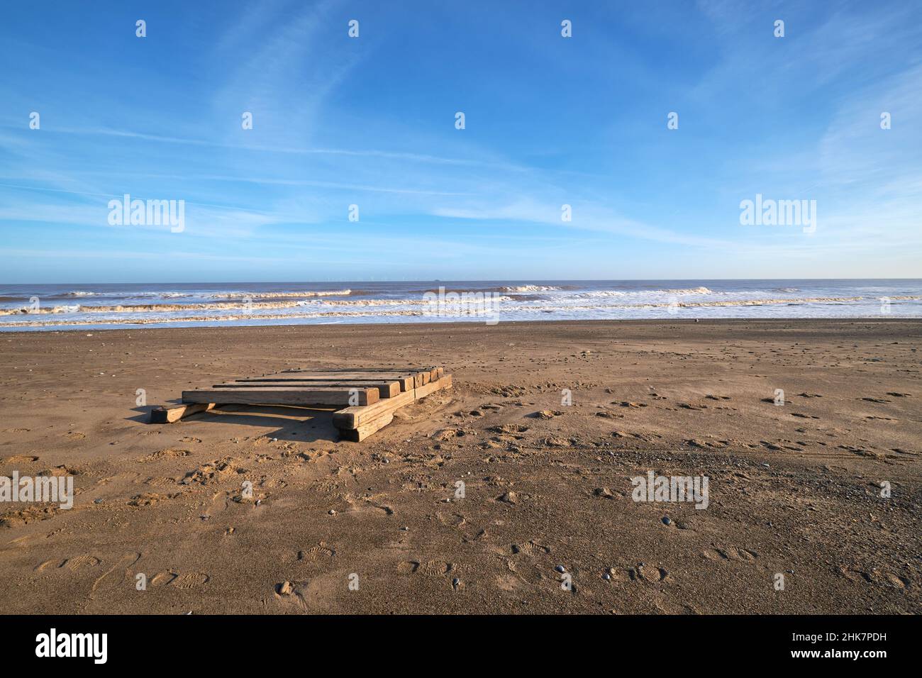 Heavy wooden raft washed up on a beach Stock Photo - Alamy