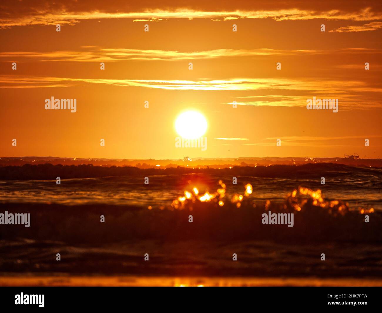 Calm waves land sunset hi-res stock photography and images - Alamy