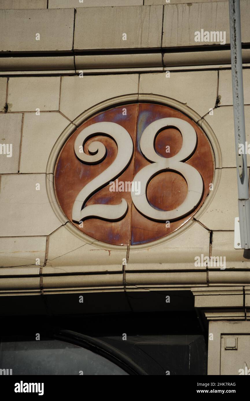 Number twenty eight on a building Stock Photo - Alamy
