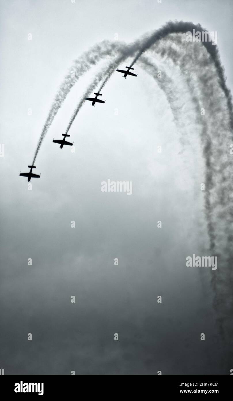 Grayscale vertical some airplanes flying in the same direction Stock ...