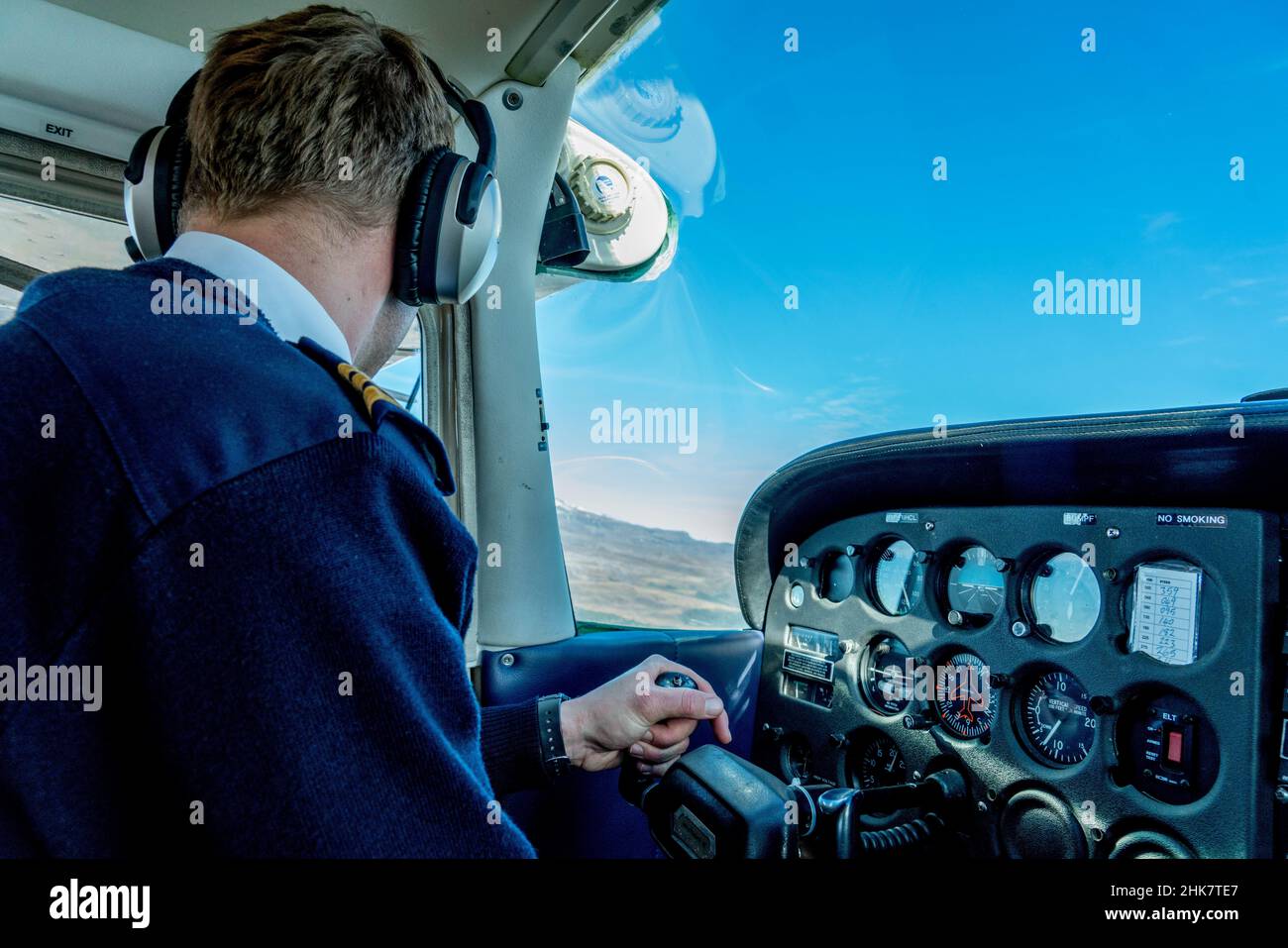 pilot at aircraft cockpit at a private flight above new zealand Stock ...
