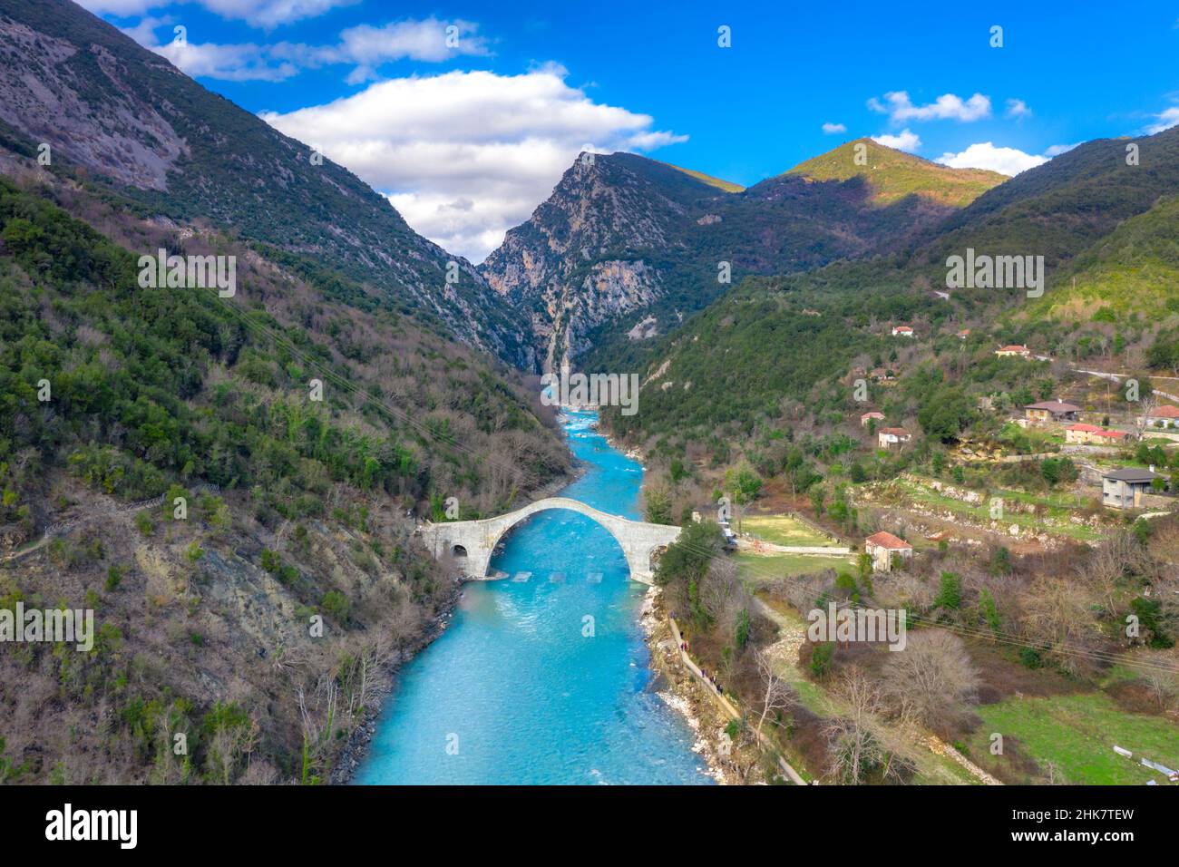 The great arched stone bridge of Plaka on Arachthos river, Tzoumerka ...