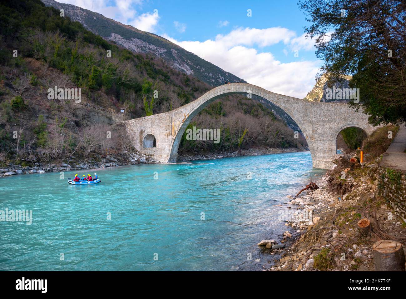 The great arched stone bridge of Plaka on Arachthos river, Tzoumerka ...