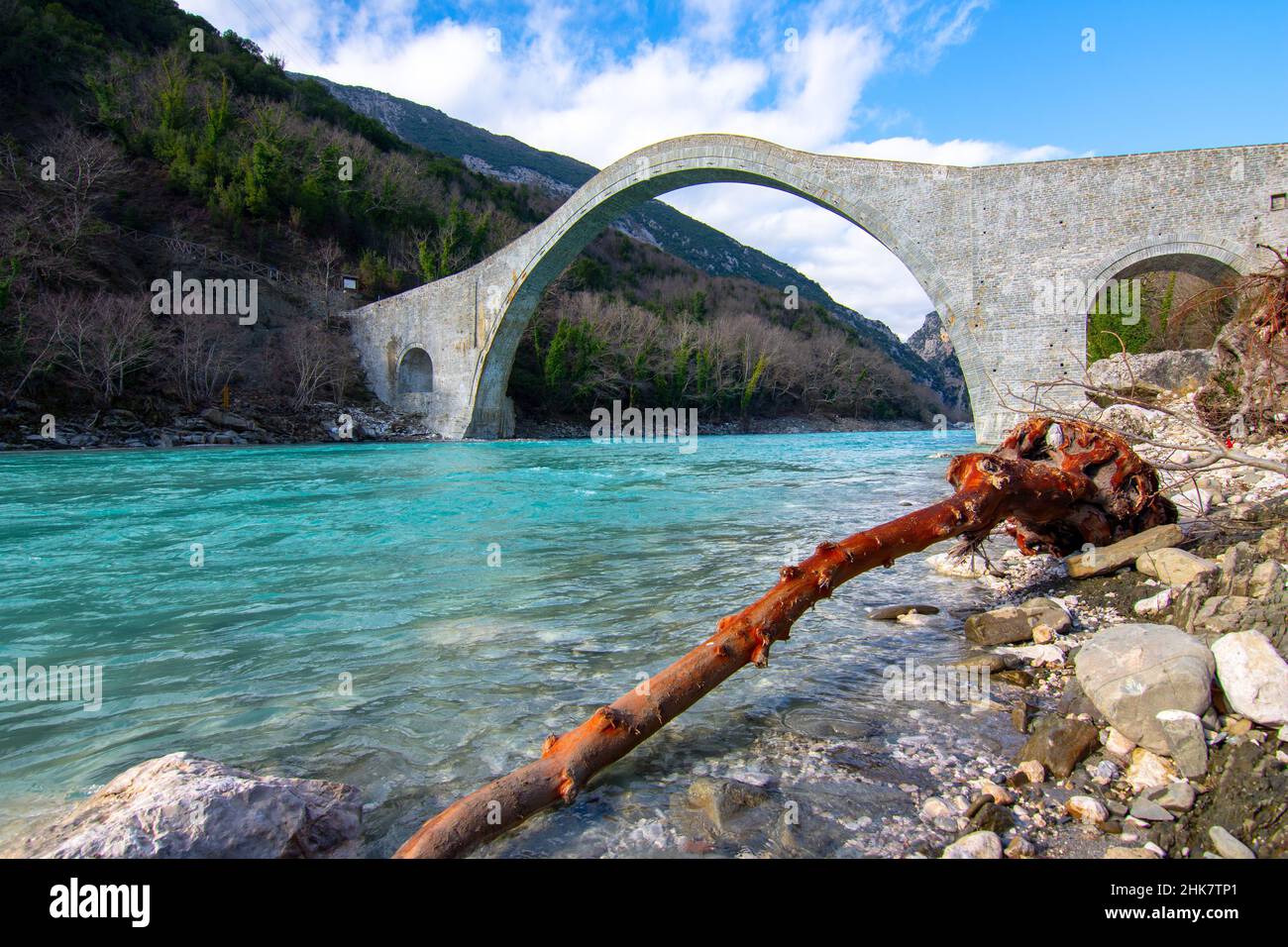 The great arched stone bridge of Plaka on Arachthos river, Tzoumerka ...