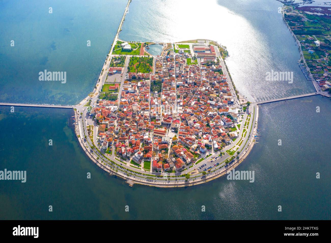 Aerial drone view of the famous island - fishing village of Aitoliko in ...
