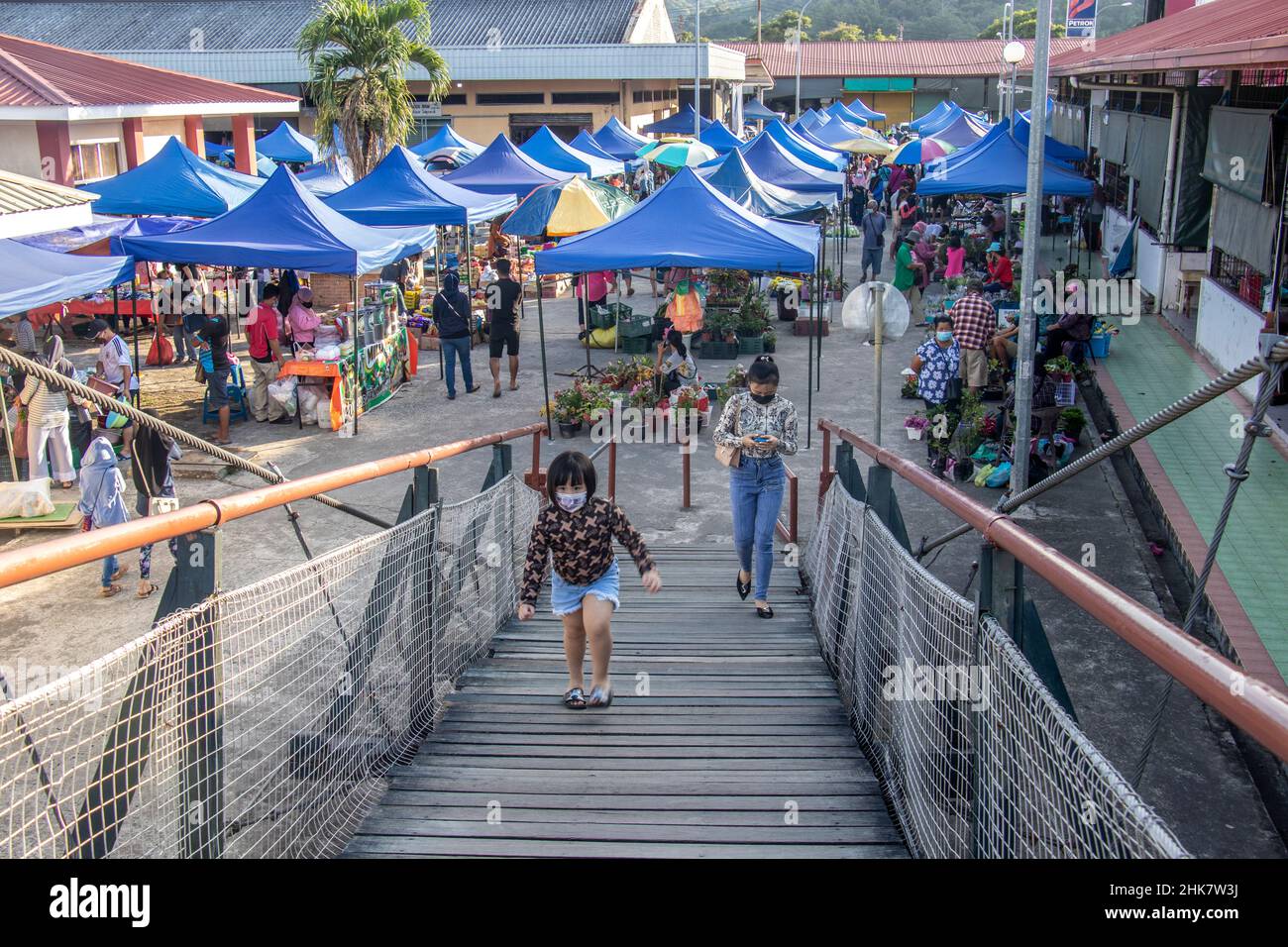 People on the Tamparuli bridge next to Tamparuli Wednesday Market Sabah ...