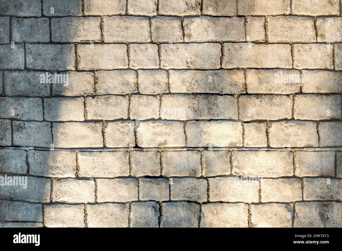 Horizontal part of rock brick wall background with natural sunlight ...