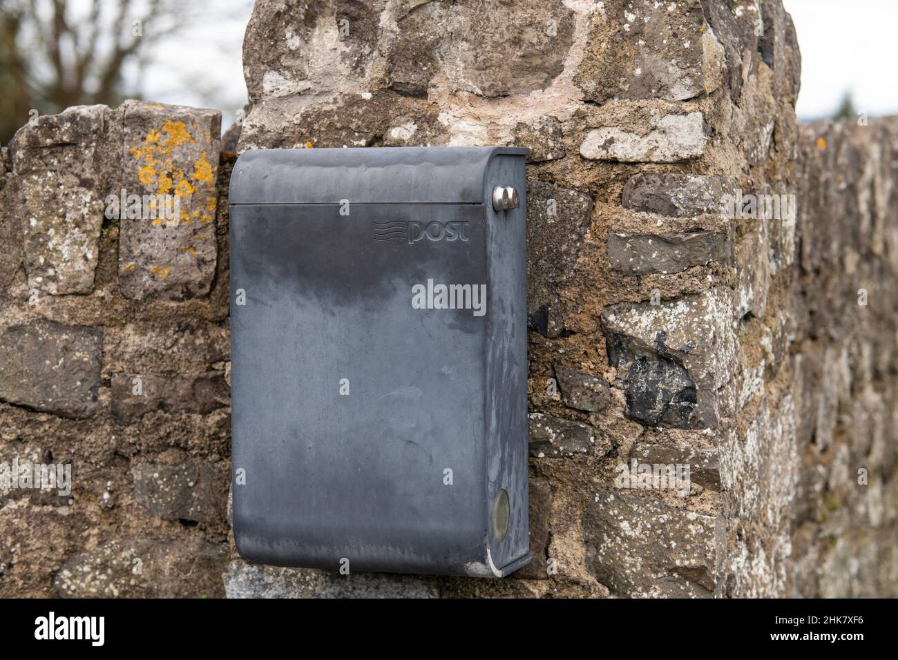 Mailboxes mounted at entry gates, mailboxes embedded in a stone wall ...