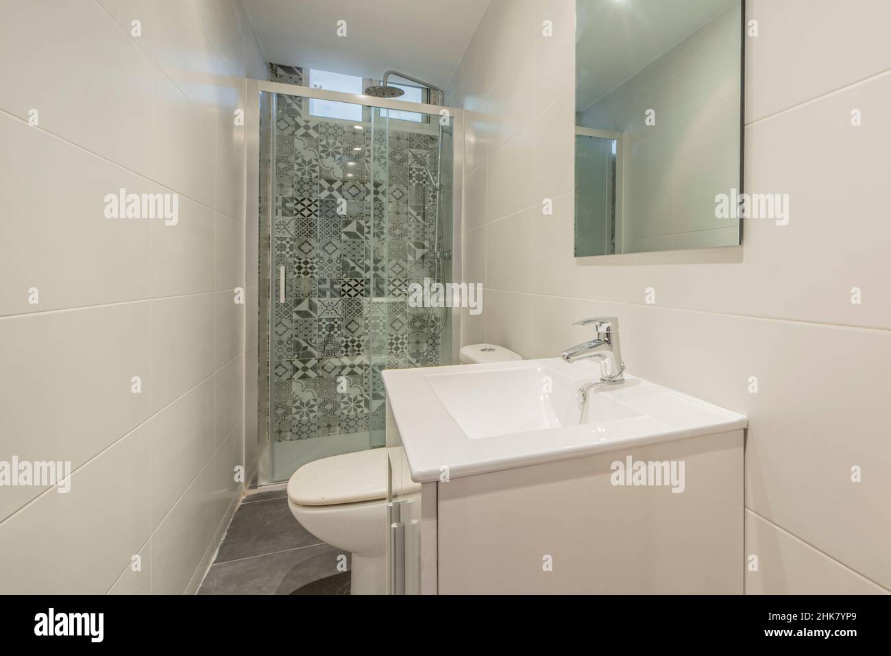 Bathroom decorated in a contemporary style with a shower wall covered ...