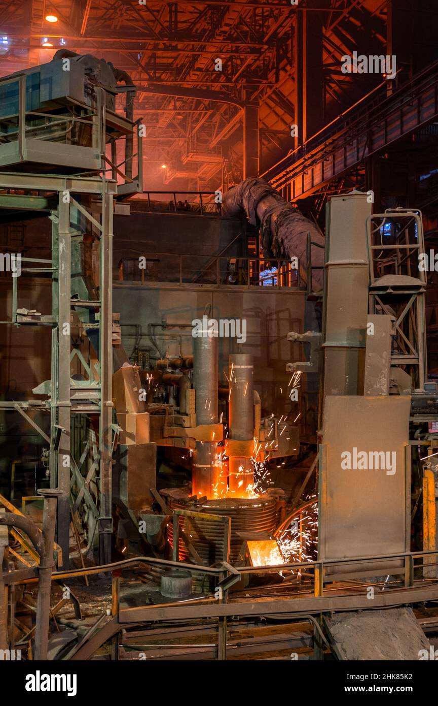 Electric arc steelmaking furnace, thick powerful red-hot graphite ...