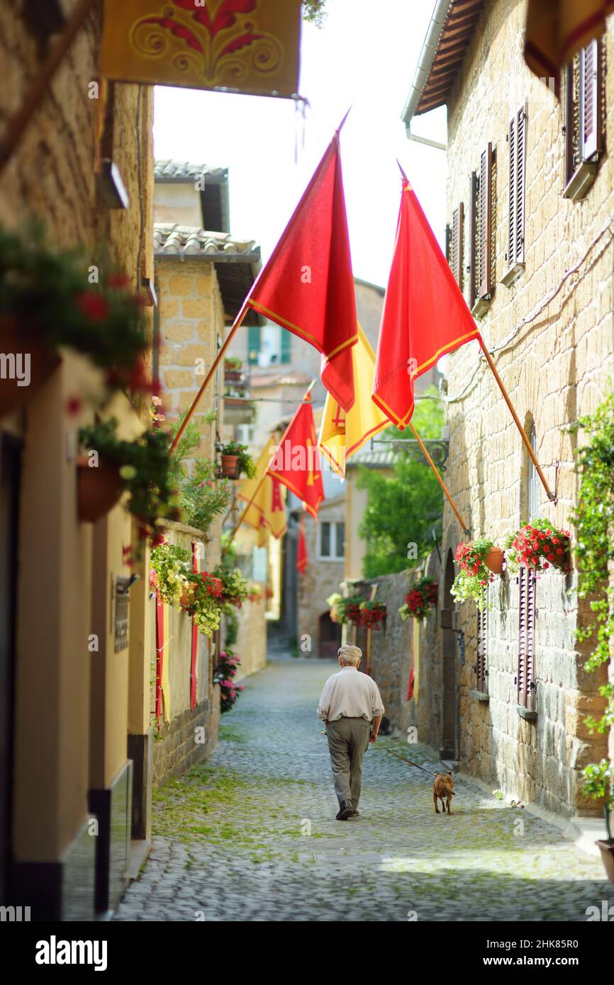 Narrow streets of the famous Orvieto, a medieval hill town, rising ...