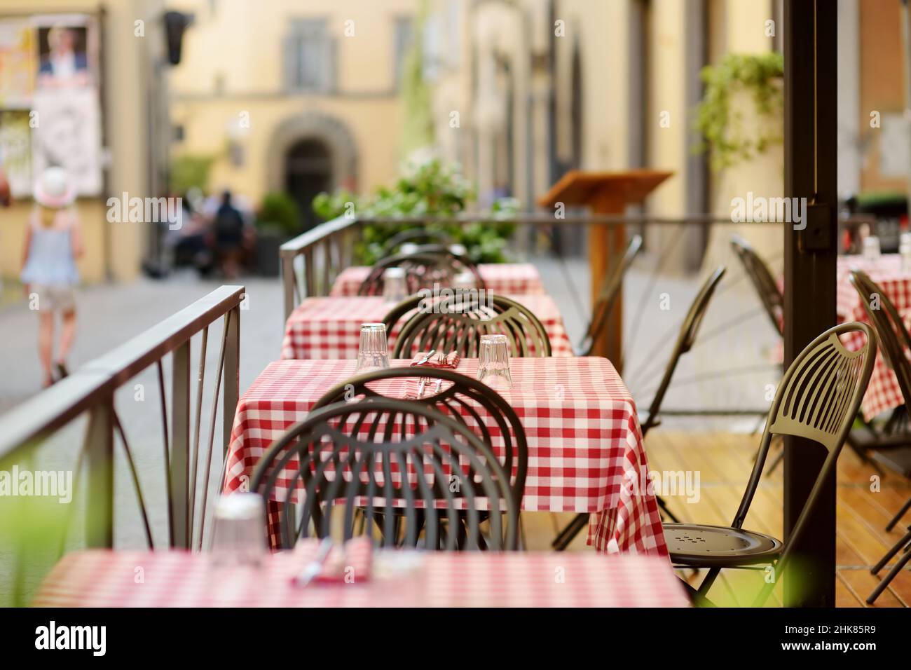 Outdoor restaurant table in Orvieto, a medieval hill town, rising above ...