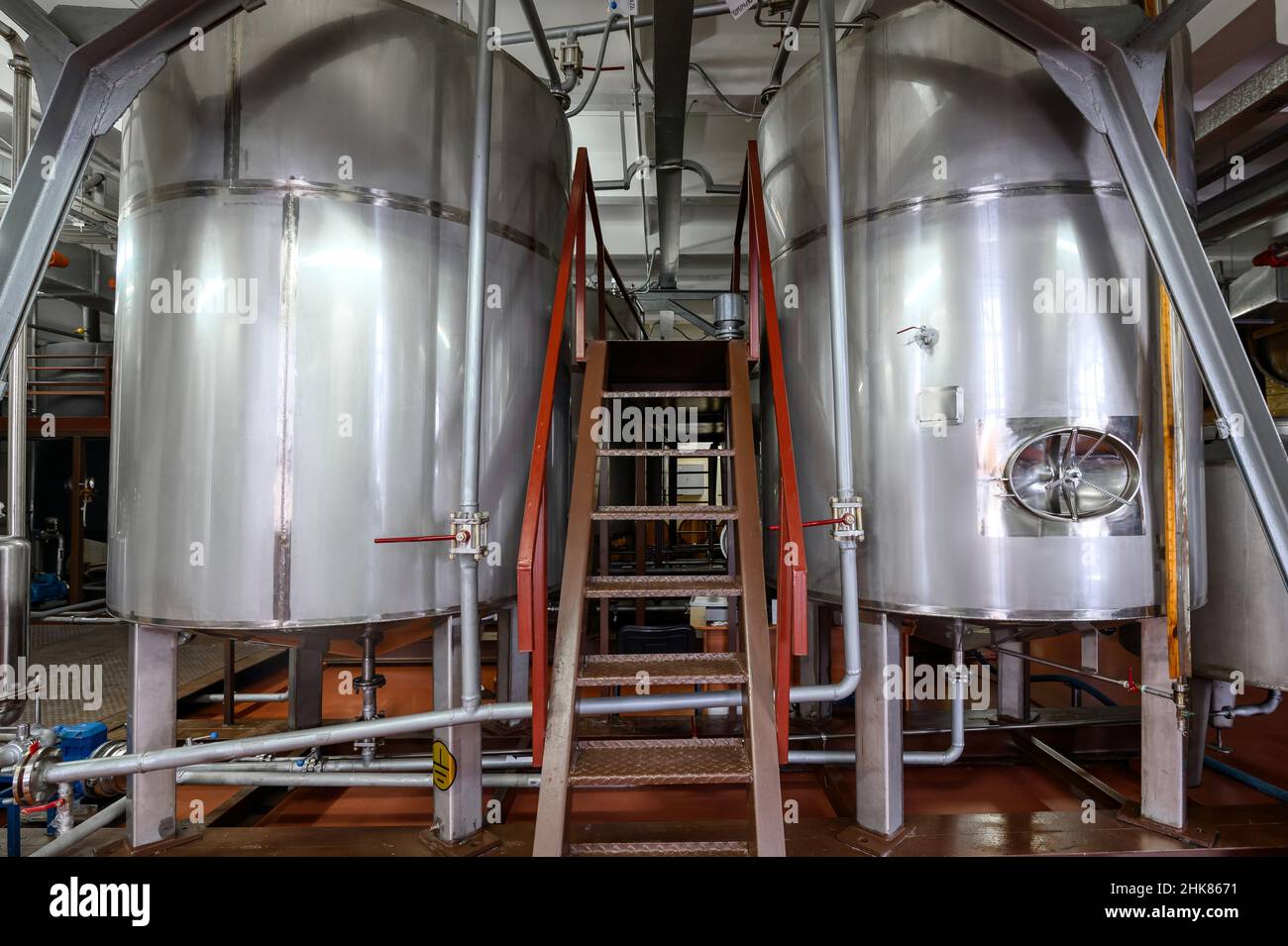 Metal tanks for making alcohol drinks in light workshop Stock Photo - Alamy