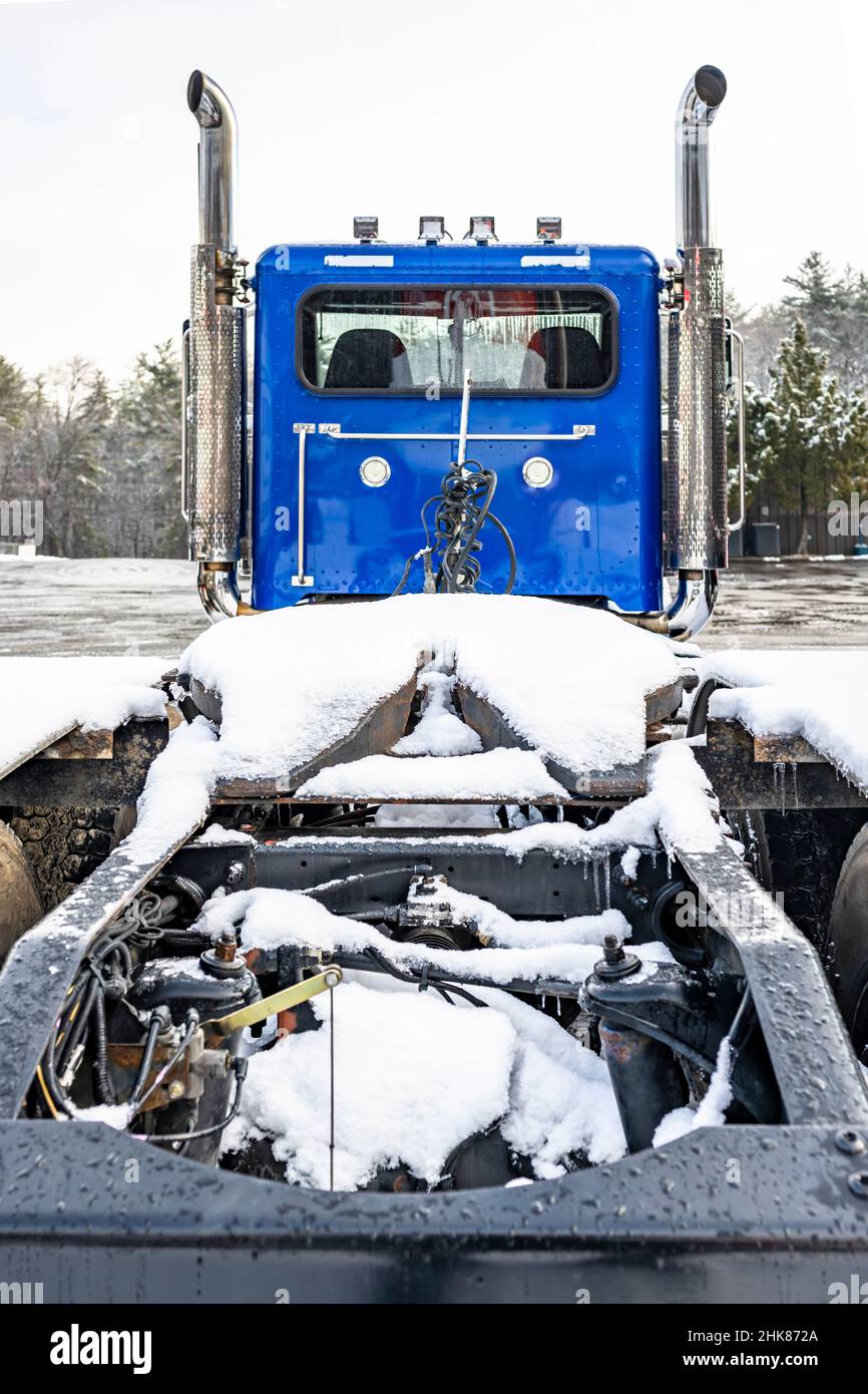 Blue big rig classic semi truck tractor with fifth wheel and metal ...