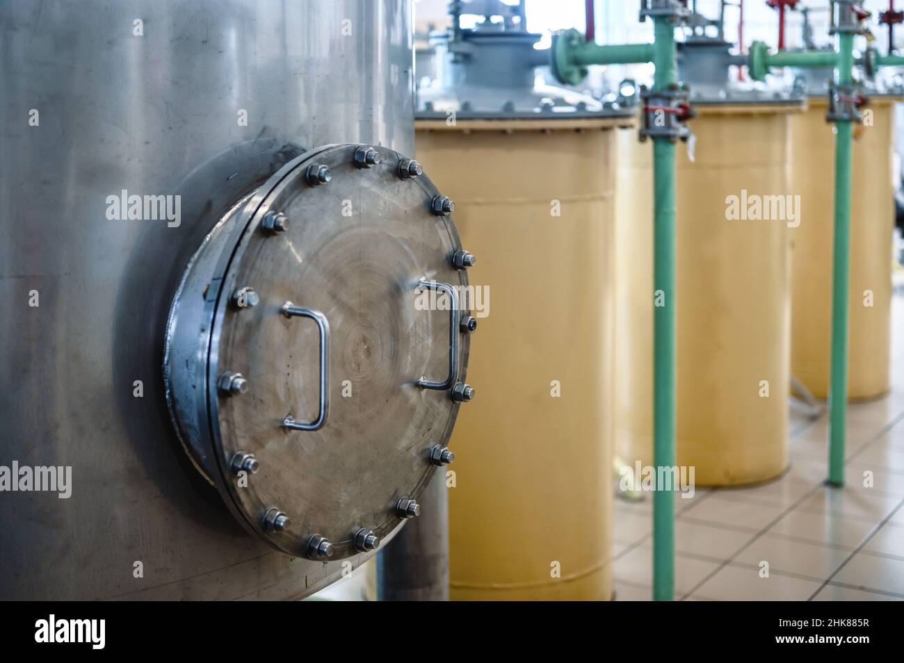Metal lid with handle on reservoir top at production plant Stock Photo ...